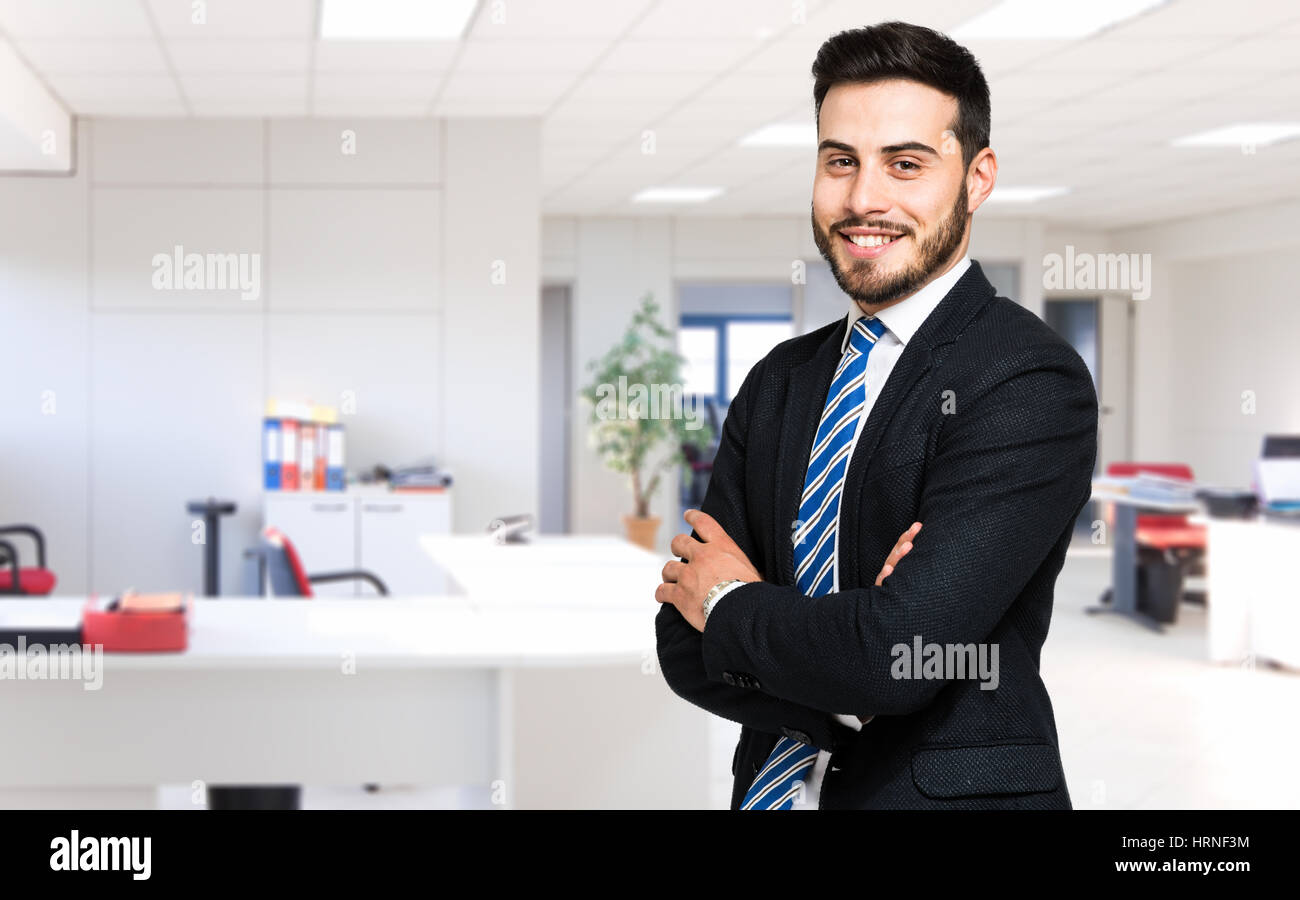 Handsome manager in his office Stock Photo - Alamy