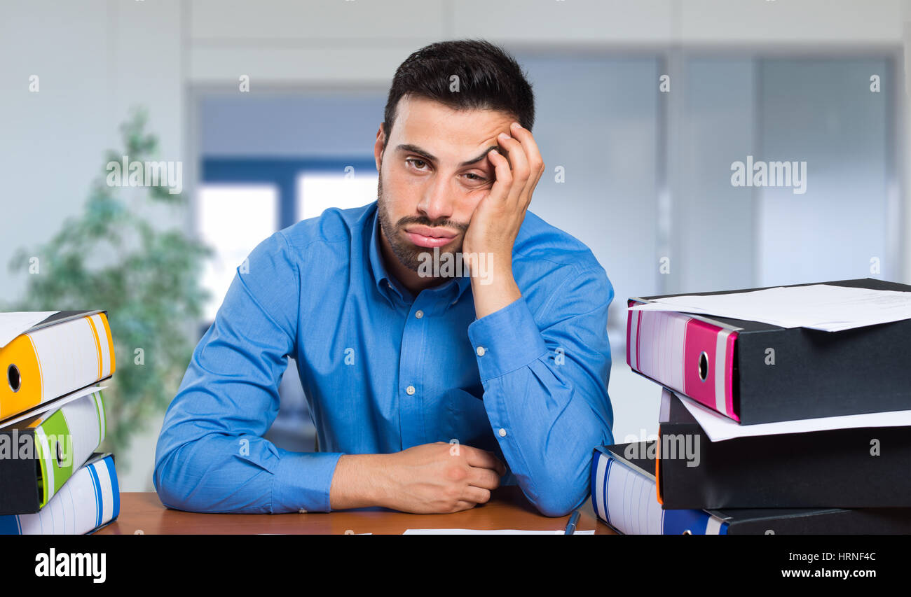 Bored businessman in his office Stock Photo - Alamy
