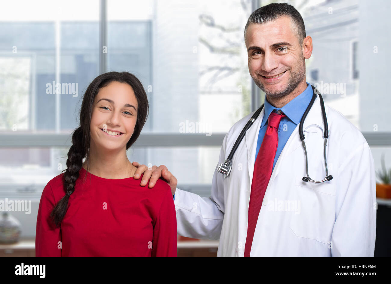 Doctor with his young teenager patient Stock Photo - Alamy