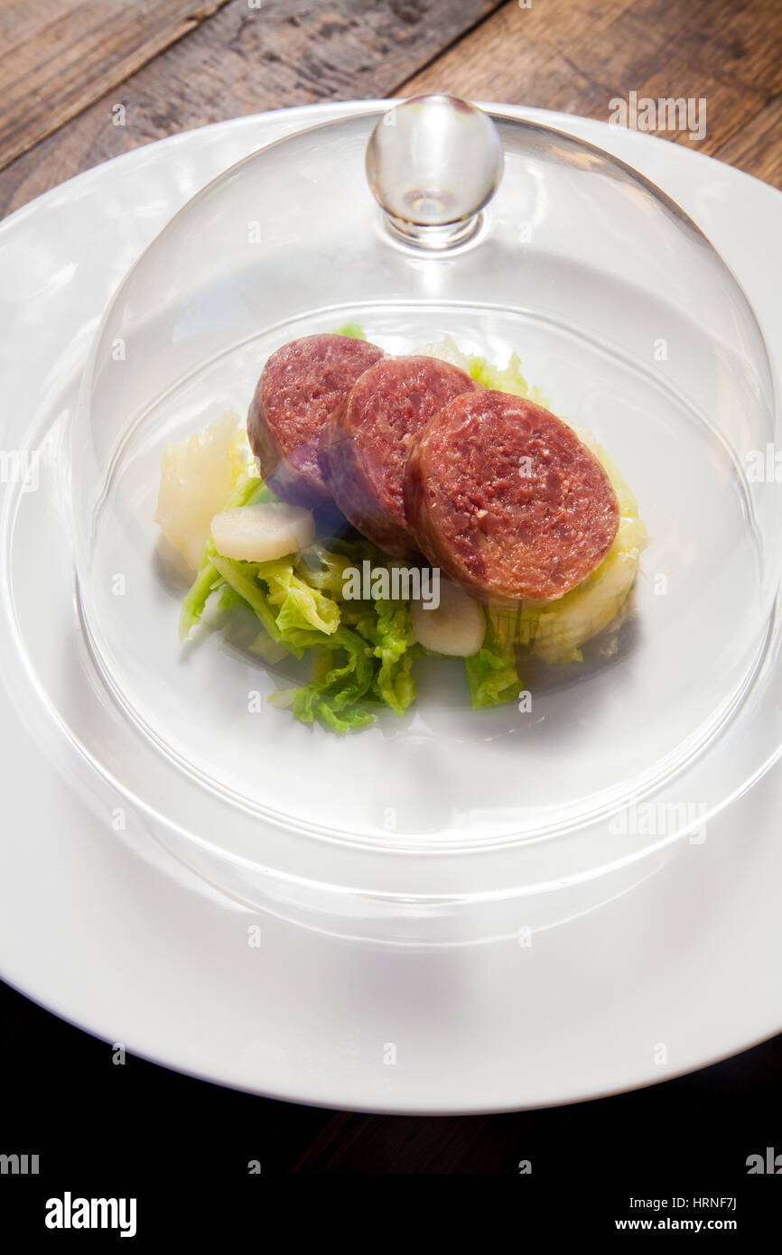 Italian cotechino in a dish Stock Photo - Alamy