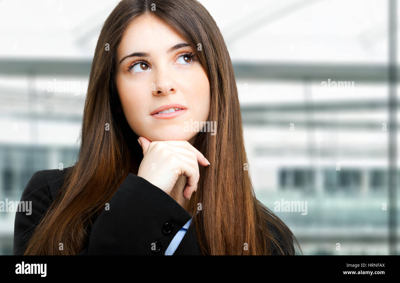 Thoughtful young woman Stock Photo - Alamy