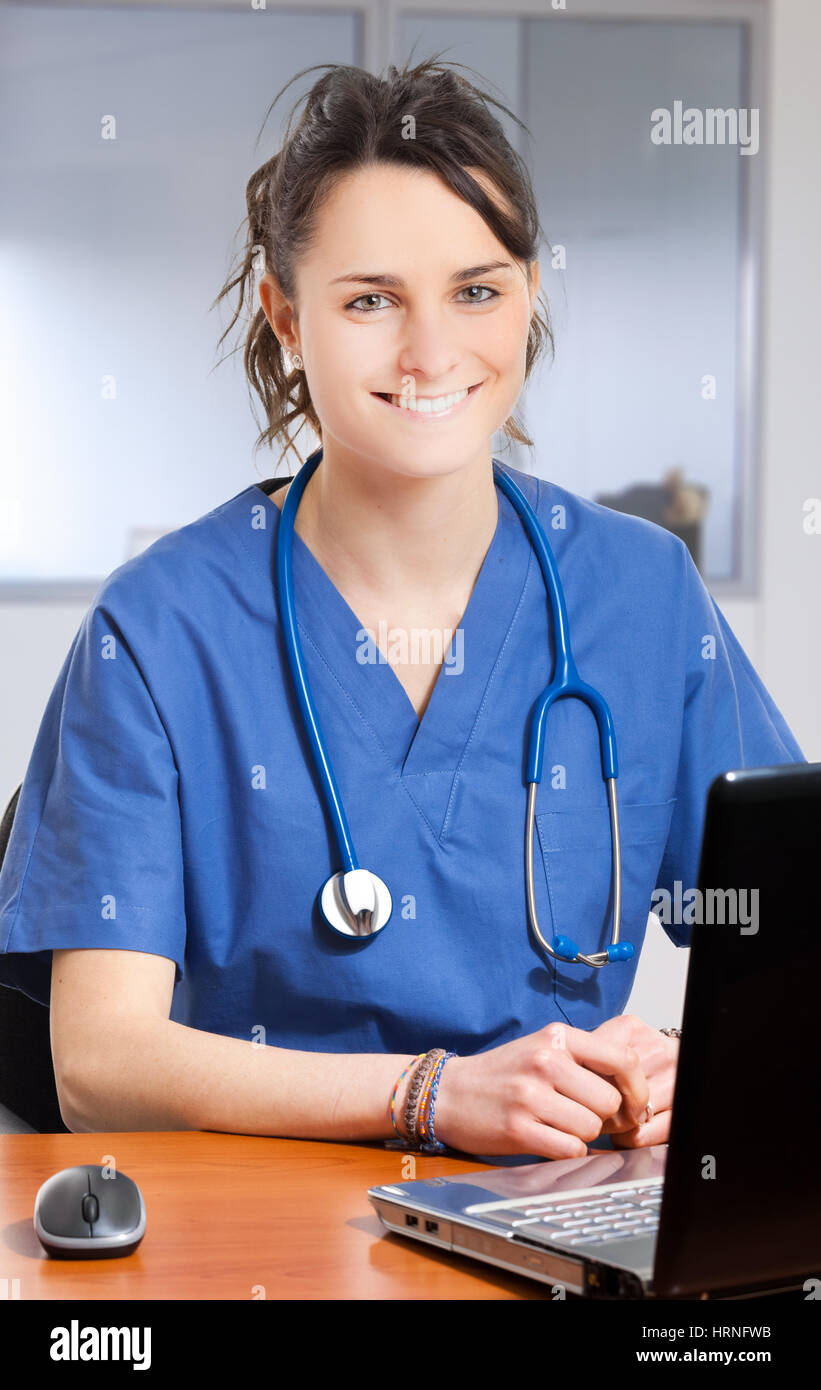 Nurse working on her laptop Stock Photo - Alamy