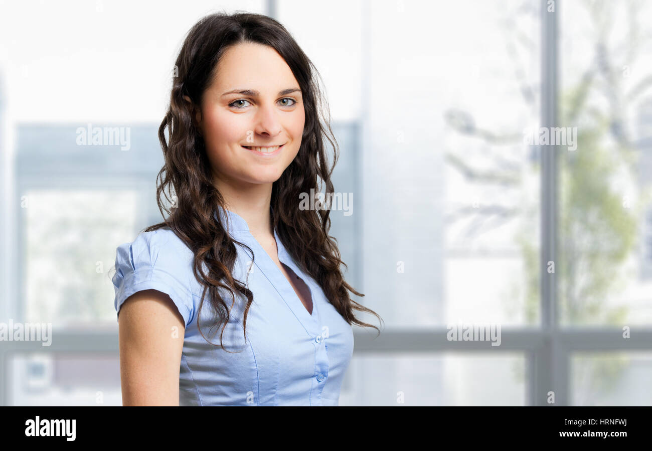 Smiling young female manager portrait Stock Photo - Alamy