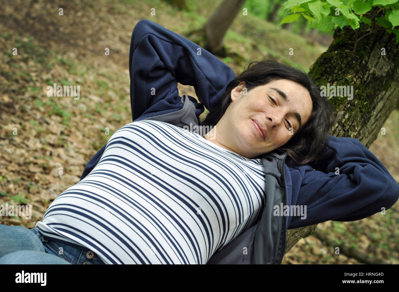 Calm pregnant woman relaxing in the forest Stock Photo - Alamy