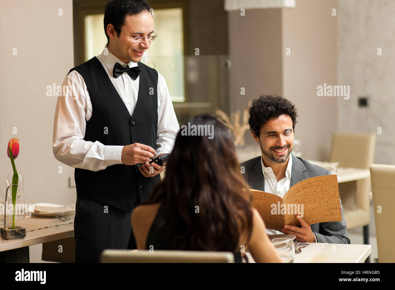 Couple ordering dinner in a luxury restaurant Stock Photo - Alamy