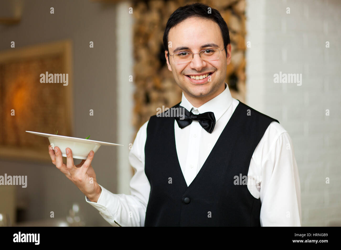 Smiling waiter portrait Stock Photo - Alamy