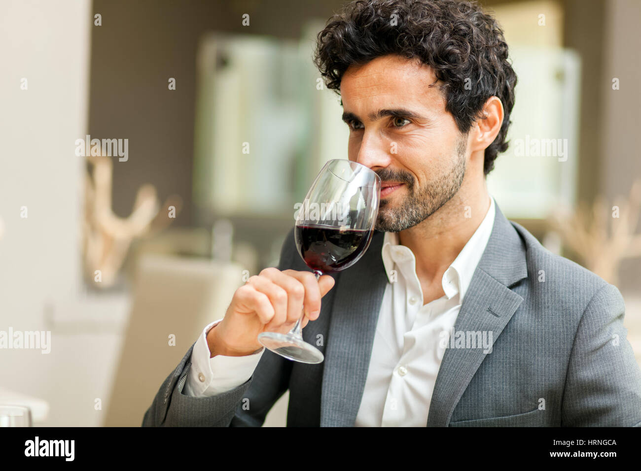 Man toasting wineglasses in a luxury restaurant Stock Photo - Alamy