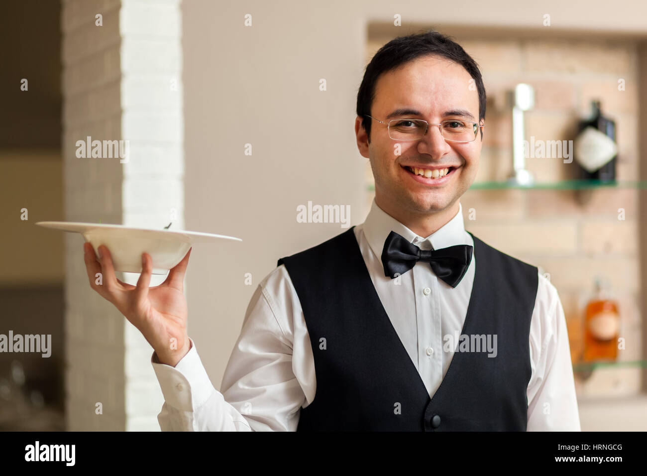 Smiling waiter portrait Stock Photo - Alamy