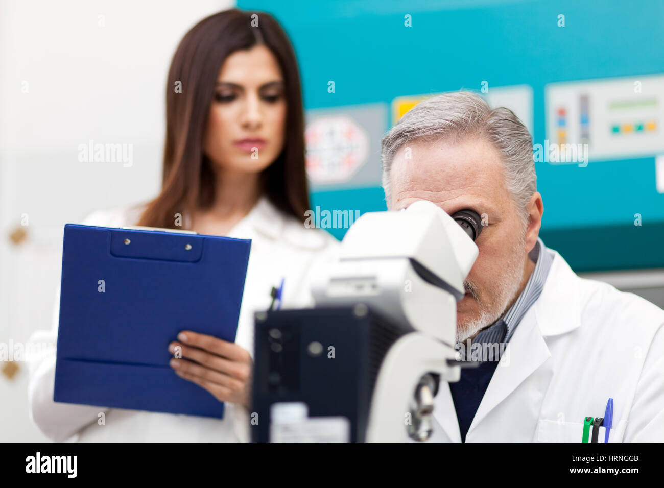 Researchers at work in a laboratory Stock Photo - Alamy