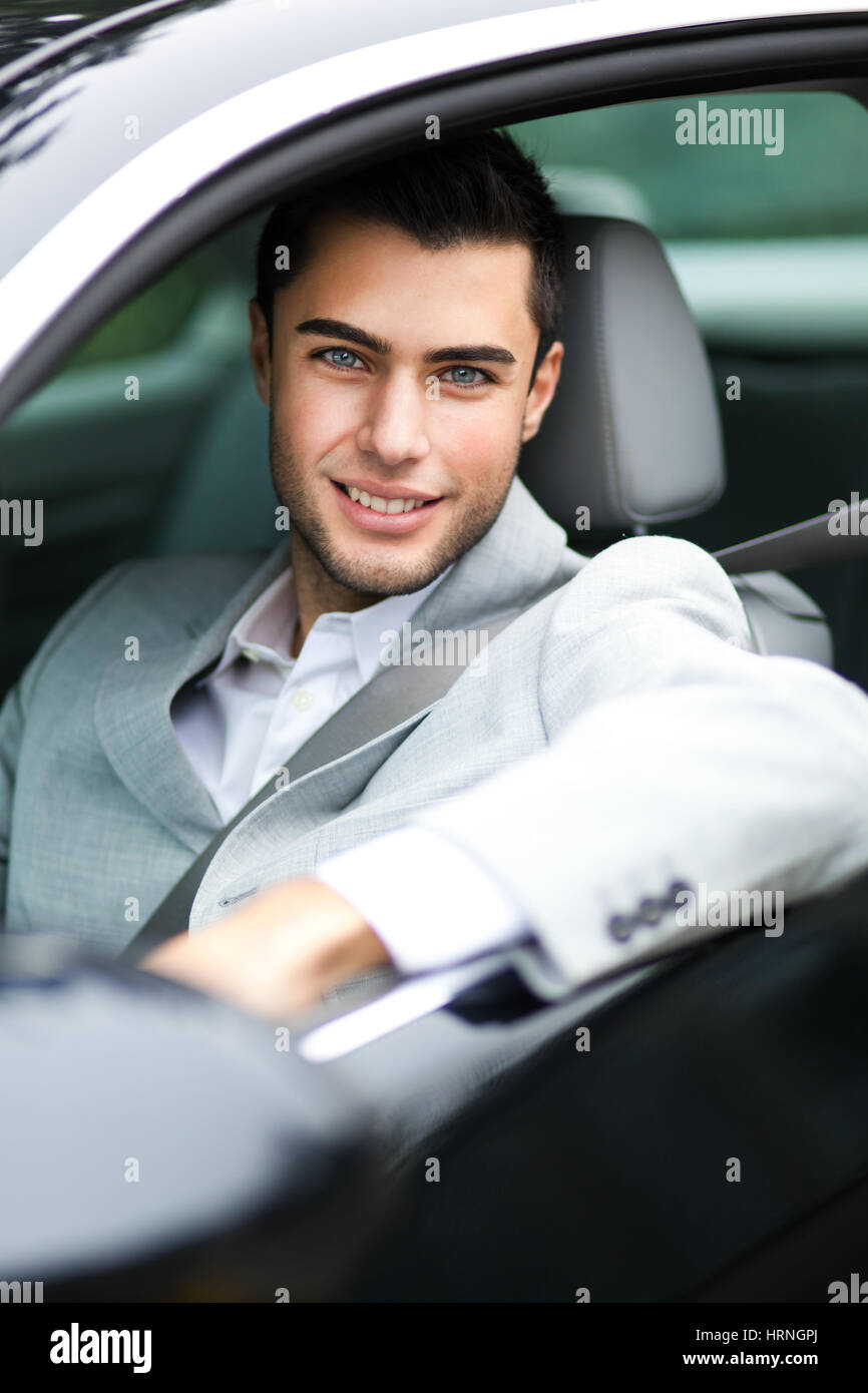 Portrait of a man driving his car Stock Photo - Alamy