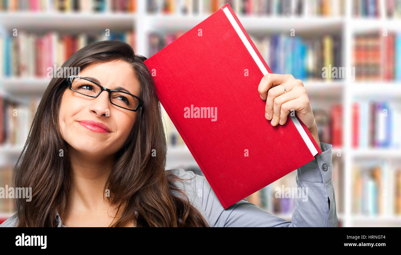 Portrait of a woman in a library Stock Photo - Alamy