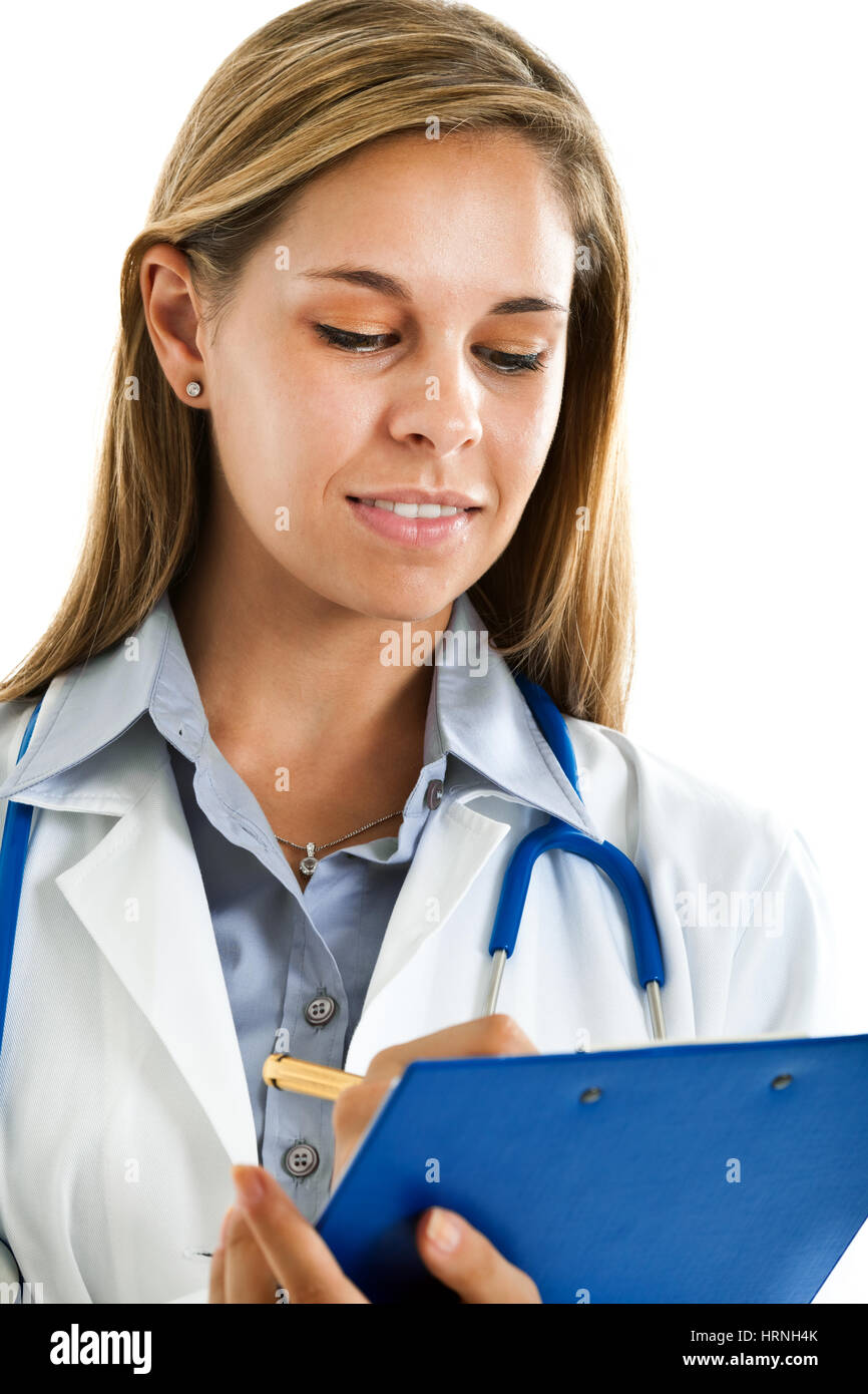 Smiling nurse writing something on her clipboard Stock Photo - Alamy