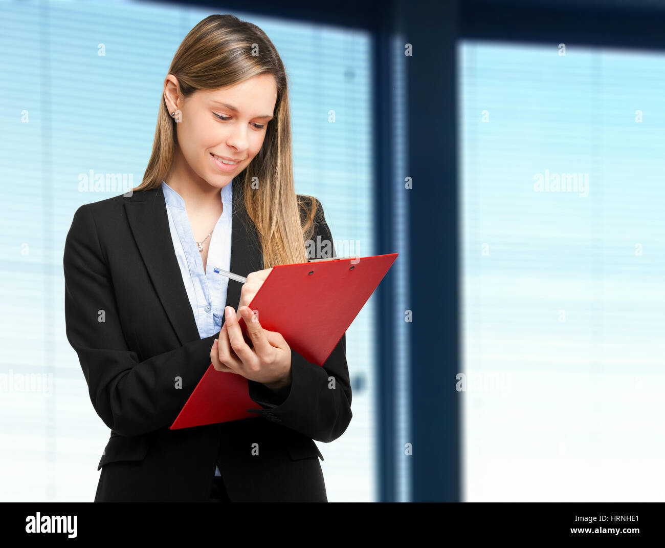 Portrait of a smiling female manager Stock Photo - Alamy