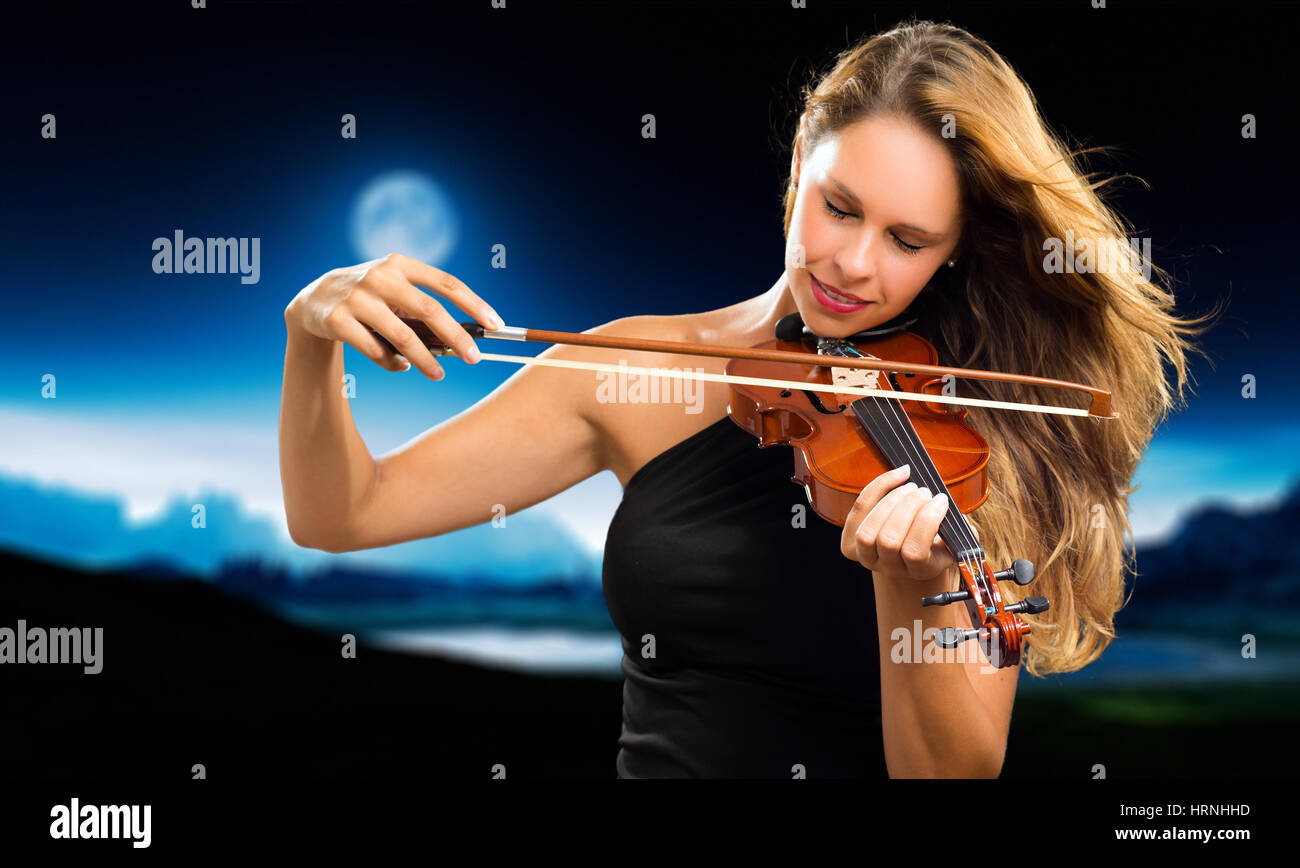 Beautiful woman playing violin hi-res stock photography and images - Alamy