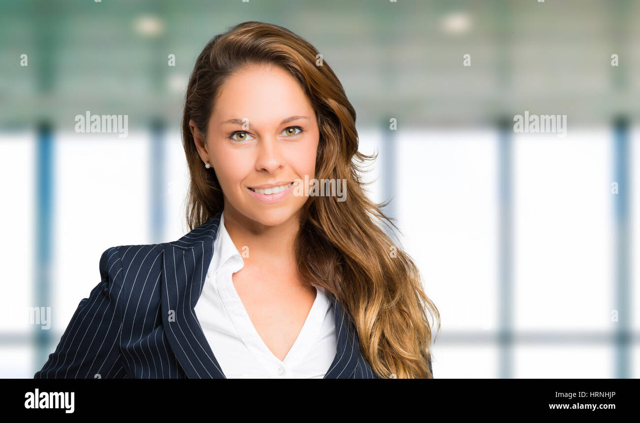 Smiling young female manager portrait Stock Photo - Alamy