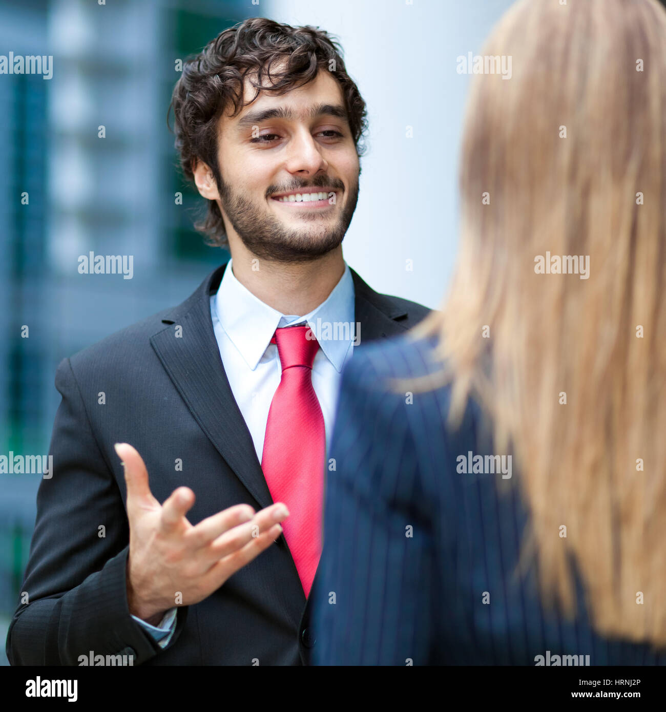 Business partners talking outdoor hi-res stock photography and images ...