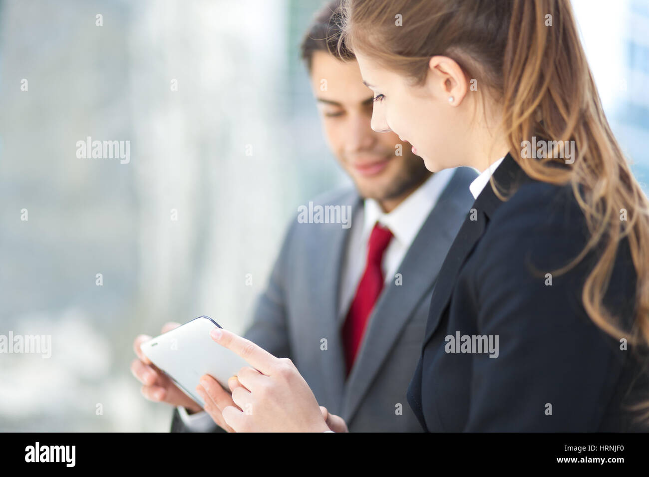 Business partners using touchscreen hi-res stock photography and images ...