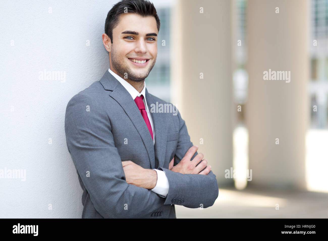 Handsome smiling businessman portrait outdoor Stock Photo - Alamy