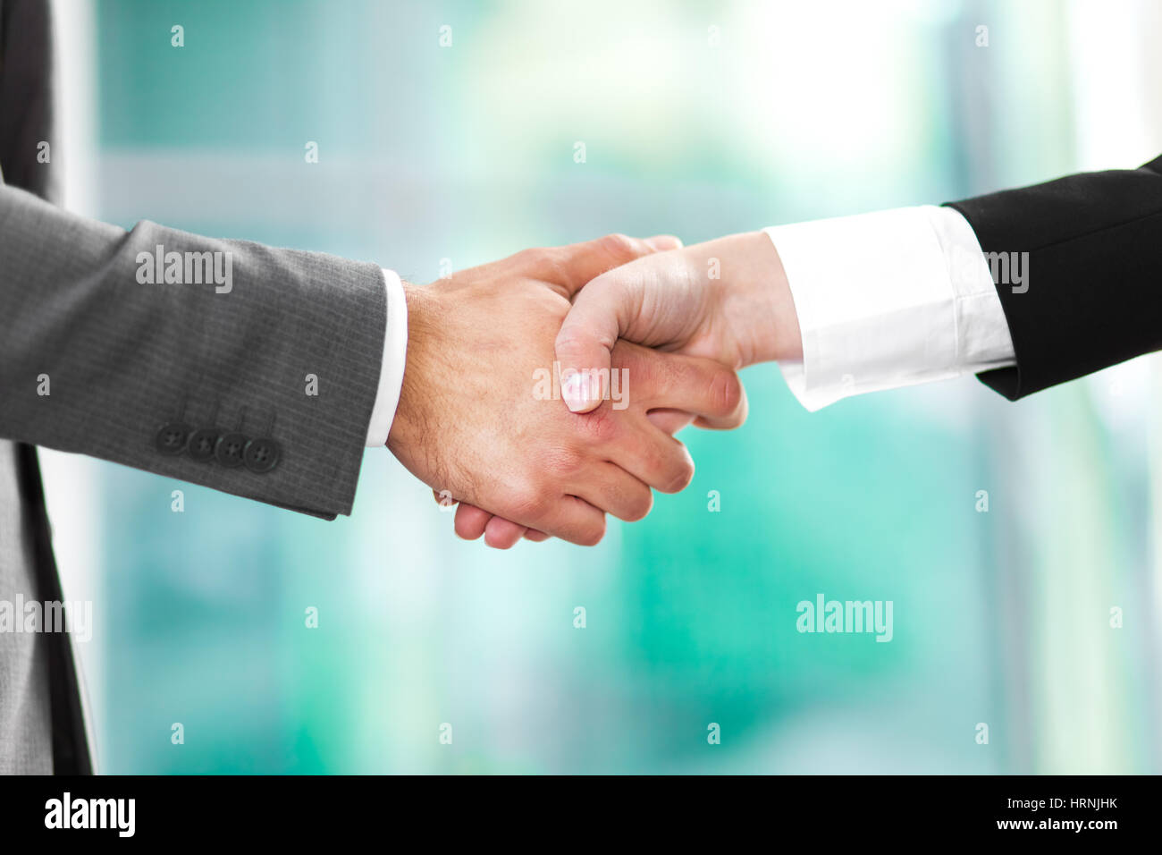 Professional business handshake between hi-res stock photography and ...