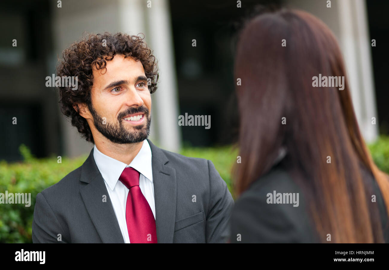 Business people talking outdoor Stock Photo - Alamy