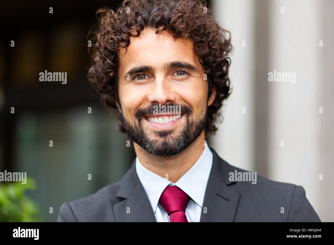 Handsome smiling business man portrait Stock Photo - Alamy Handsome smiling business man portrait Stock Photo - Alamy