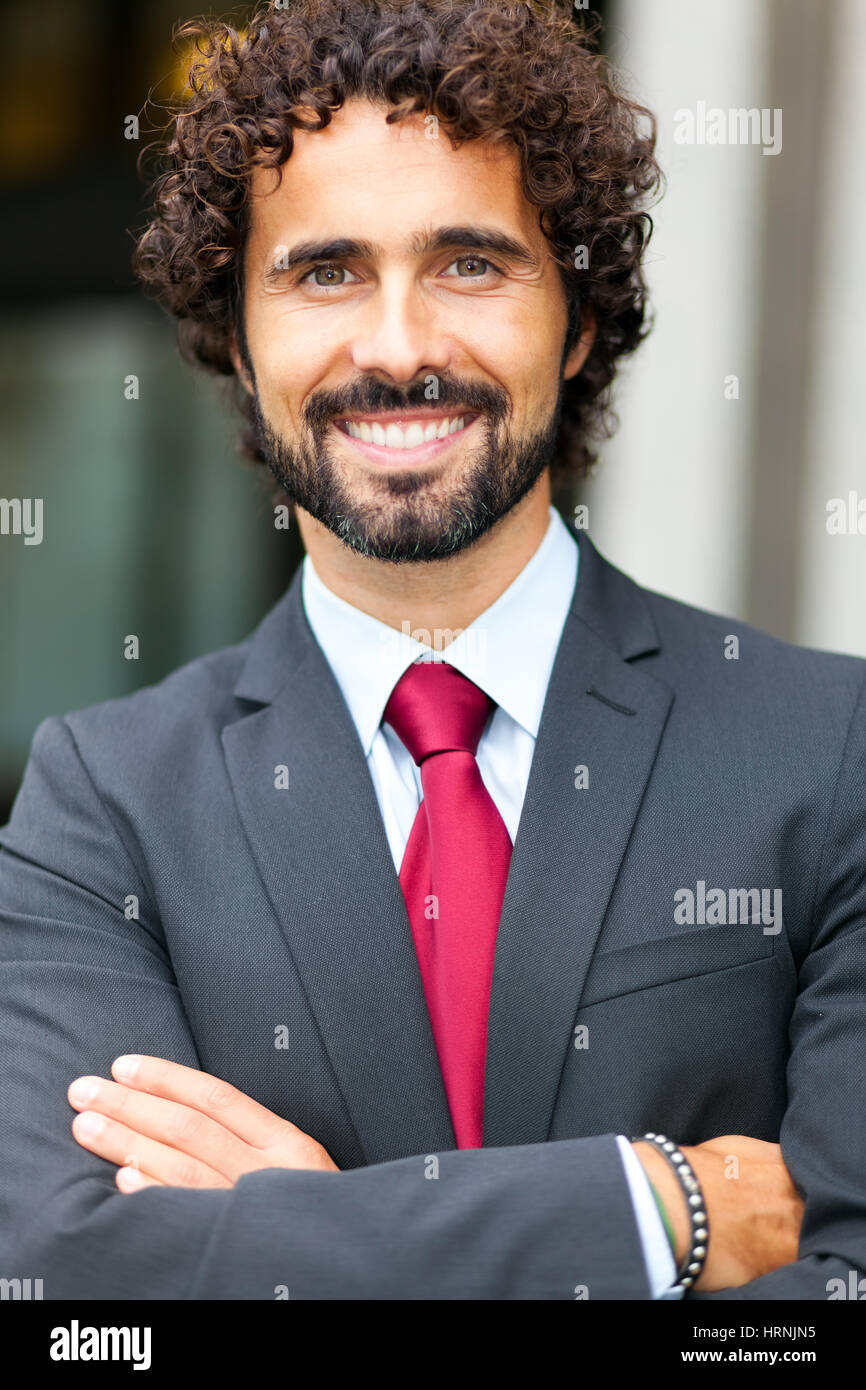 Handsome smiling business man portrait Stock Photo - Alamy