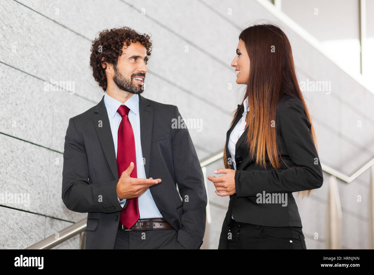 Two business people discussing outdoor Stock Photo - Alamy Two business people discussing outdoor Stock Photo - Alamy