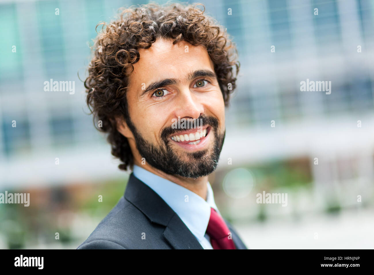 Handsome businessman portrait Stock Photo - Alamy