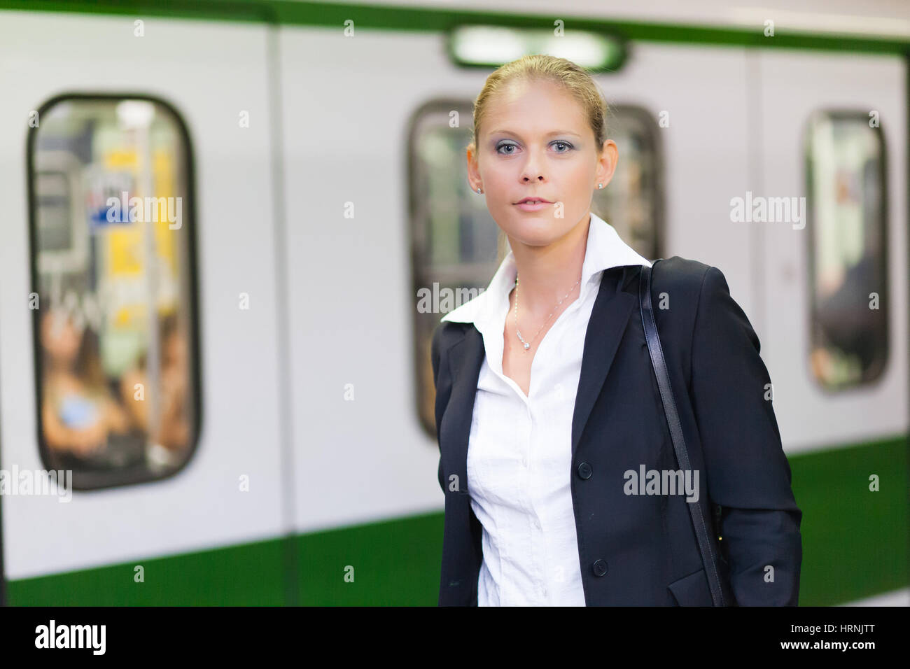 Businesswoman portrait inside metro subway Stock Photo - Alamy