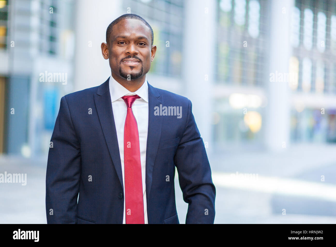 Smiling african businessman outdoor Stock Photo - Alamy