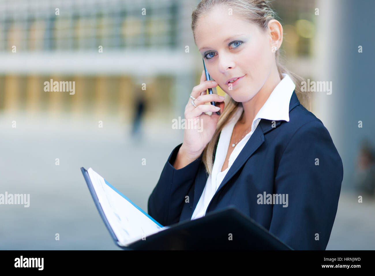 Portrait of a busy businesswoman at work Stock Photo - Alamy
