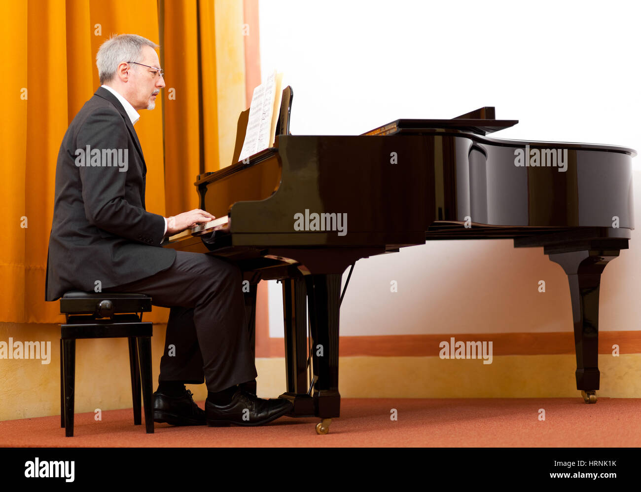 Man playing piano Stock Photo - Alamy