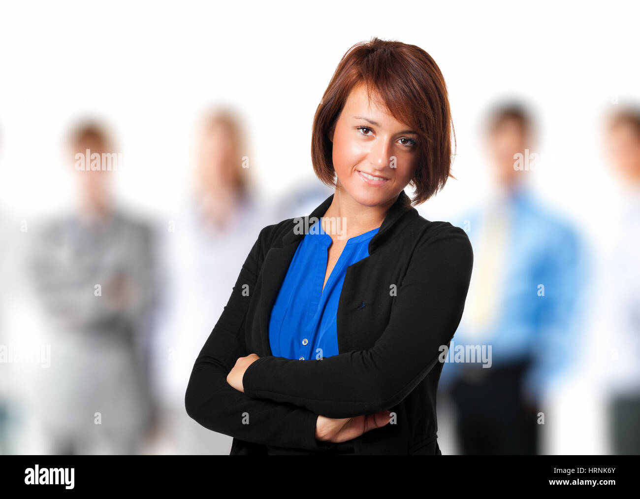 Beautiful female manager in front of her team Stock Photo - Alamy