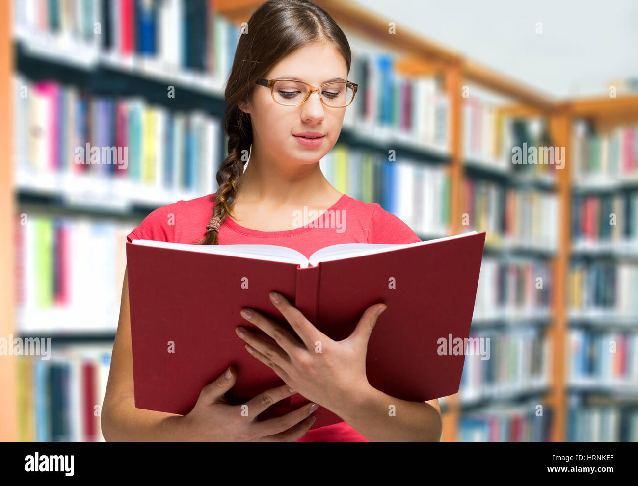 Portrait of a woman reading a book Stock Photo - Alamy