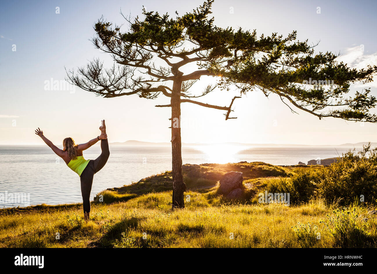 A woman practicing yoga in a beautiful outdoor setting Stock Photo - Alamy