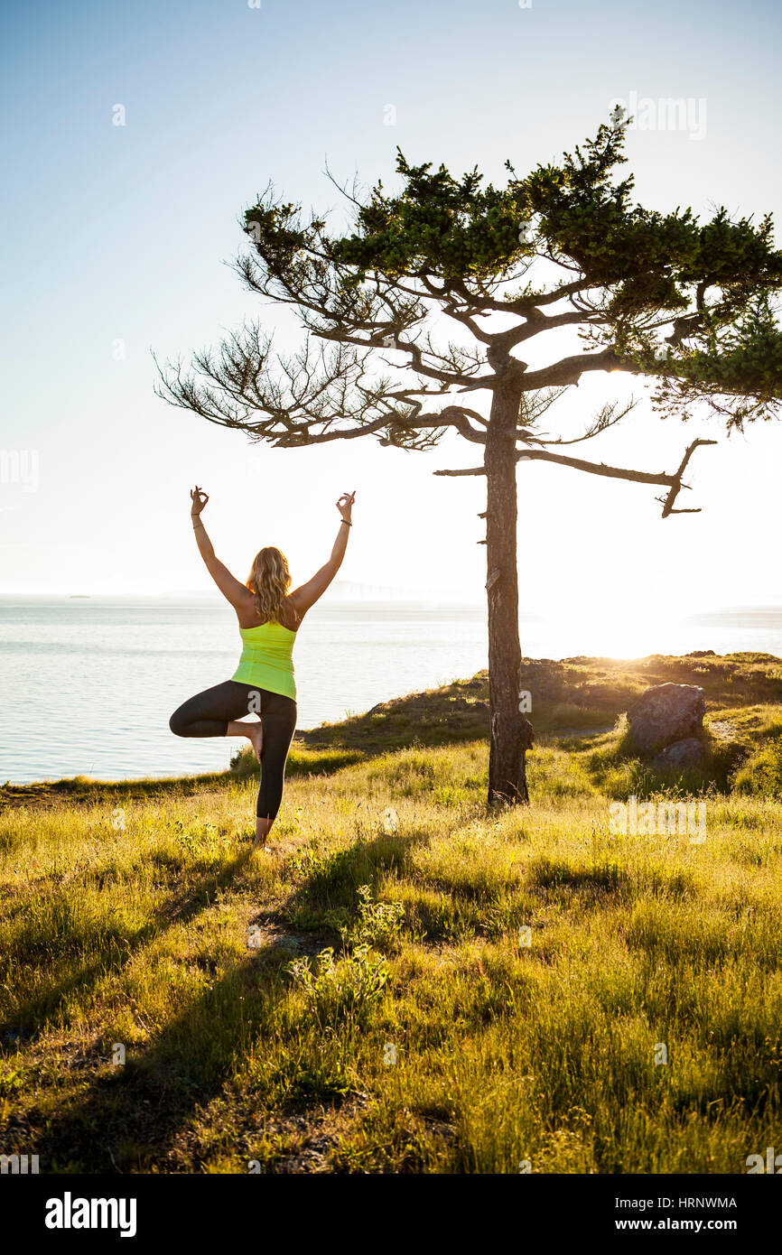 A woman practicing yoga in a beautiful outdoor setting Stock Photo - Alamy