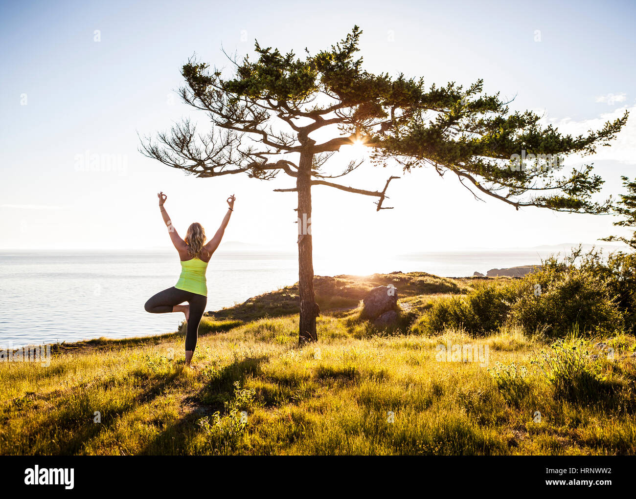 A woman practicing yoga in a beautiful outdoor setting Stock Photo - Alamy