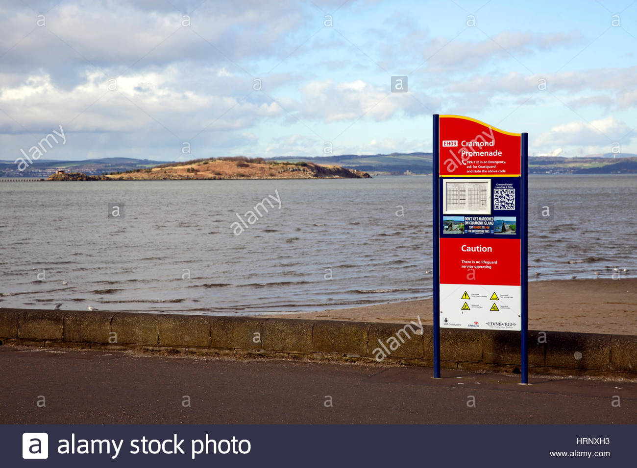 Sign for Cramond Promenade with Cramond island behind, Edinburgh Stock ...