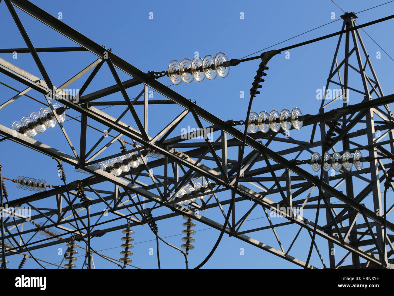 great pylon of high voltage cables with tempered glass insulators in ...