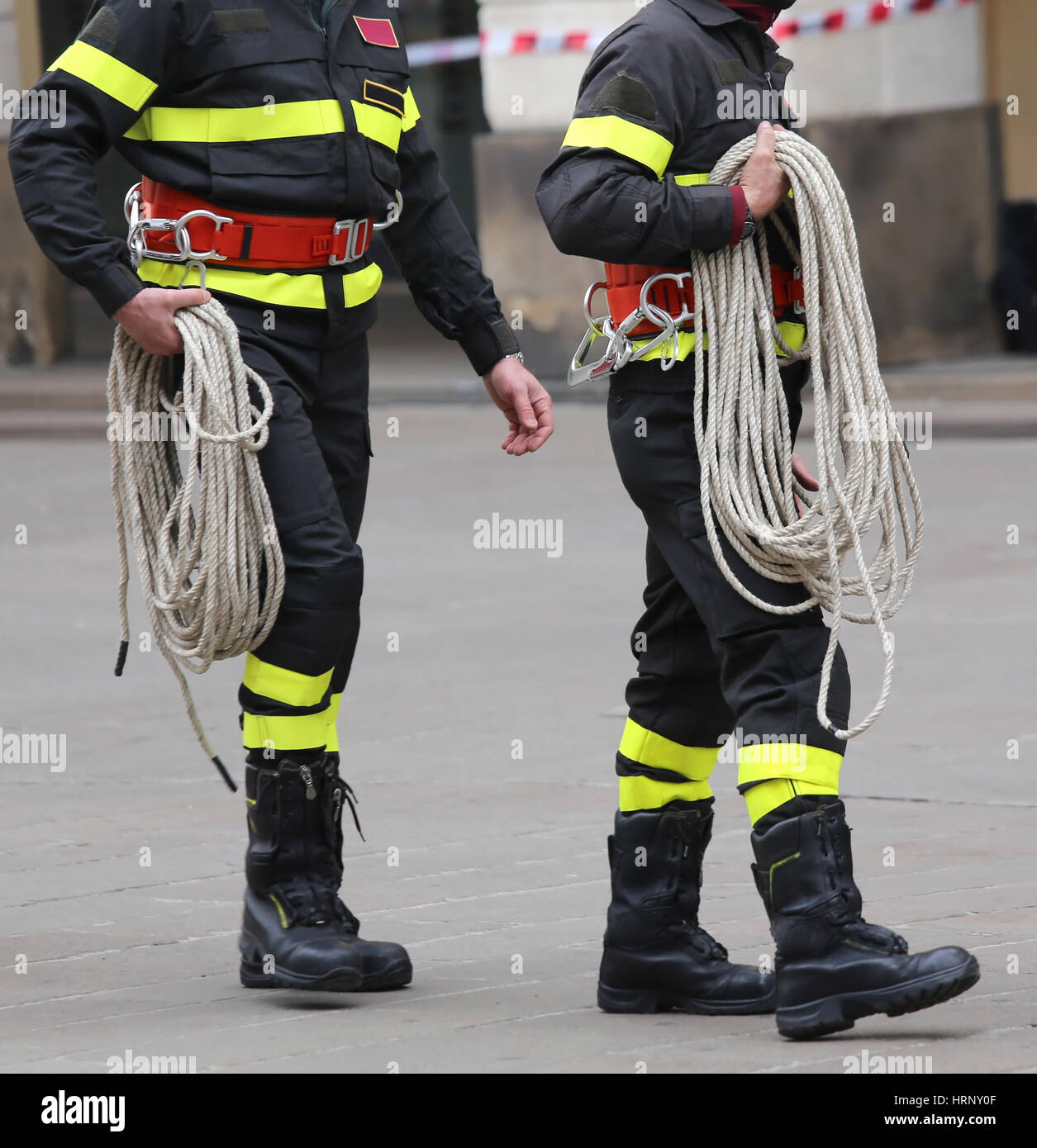 two firefighters with a long rope during the rescue operation Stock ...