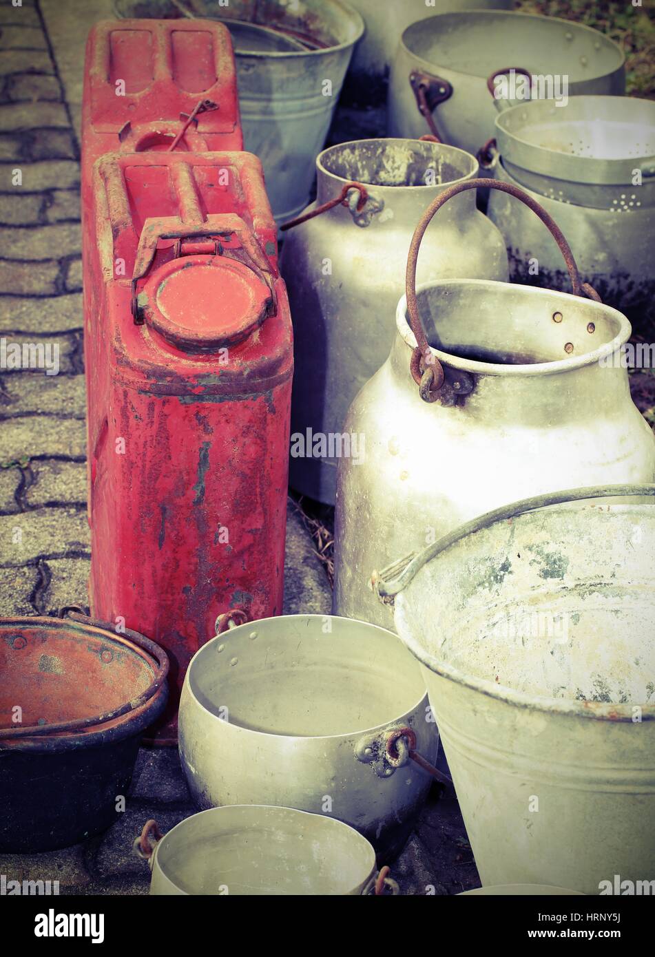 deposit of a junk shop with old aluminum container and an ancient red ...