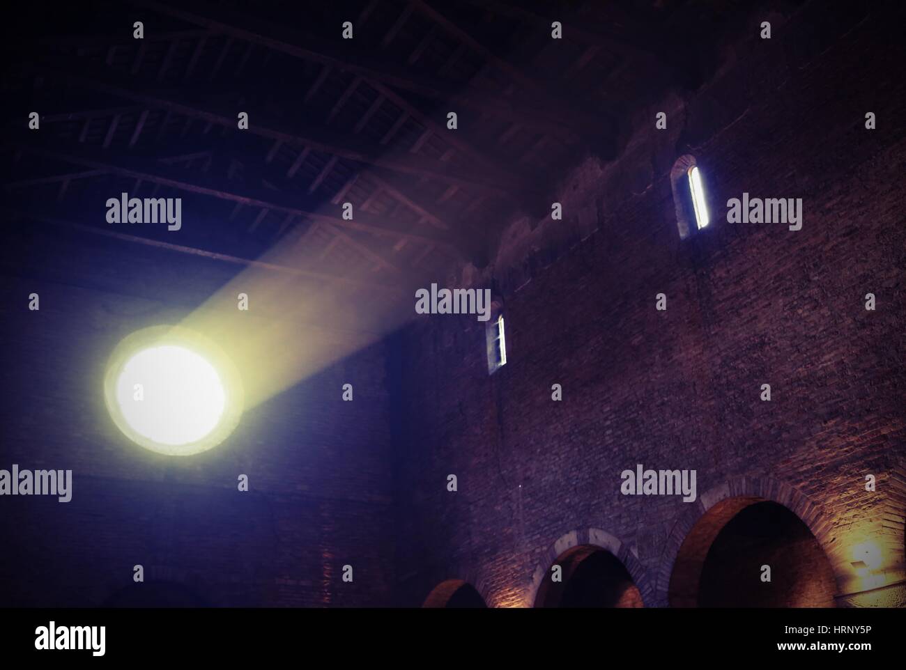 beam of light from the rose window into an very old cathedral Stock ...