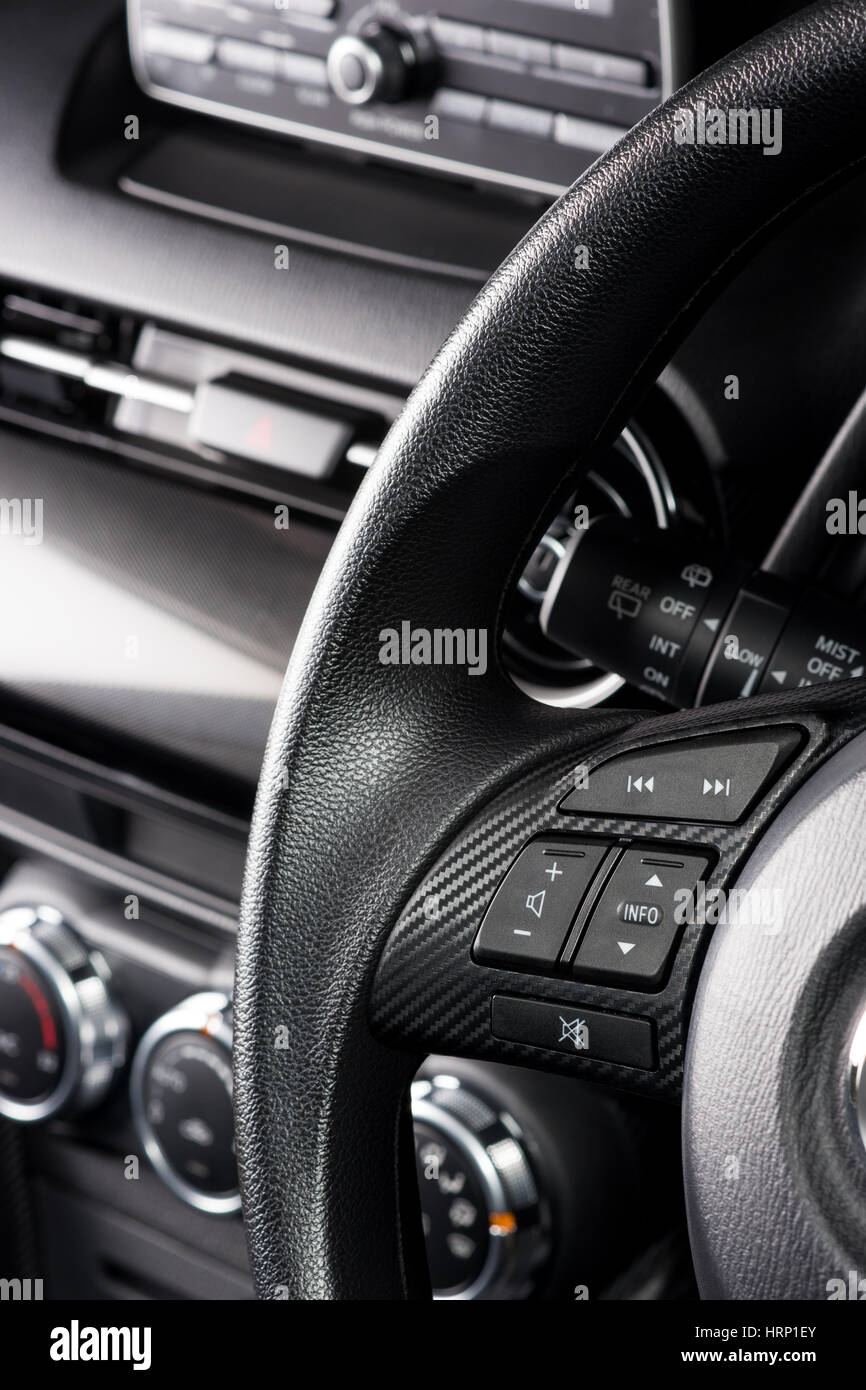 audio control bottons on steering wheel of modern car Stock Photo - Alamy