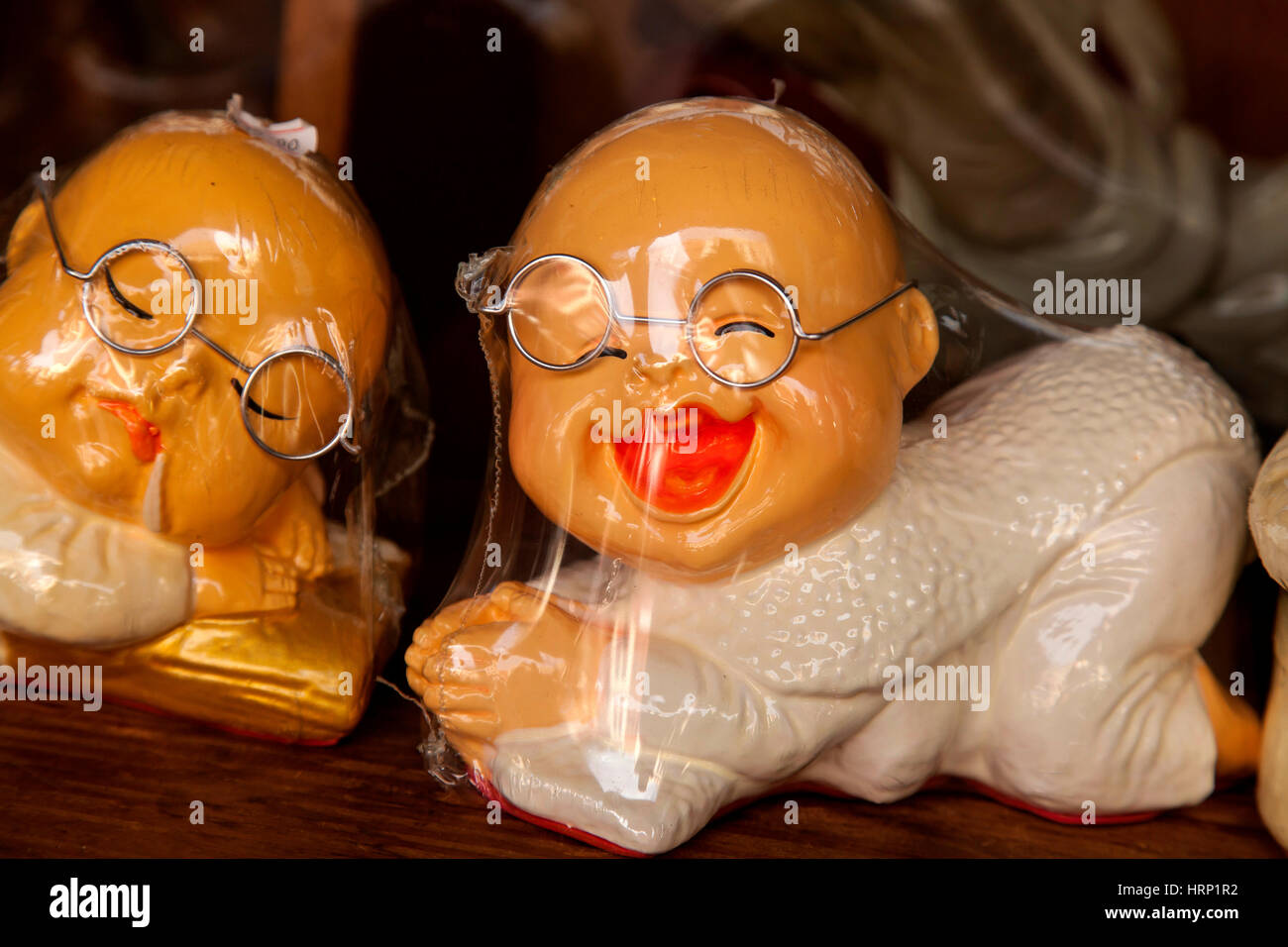 Sleeping chinese, sleeping man with bald and glasses, clay figure ...