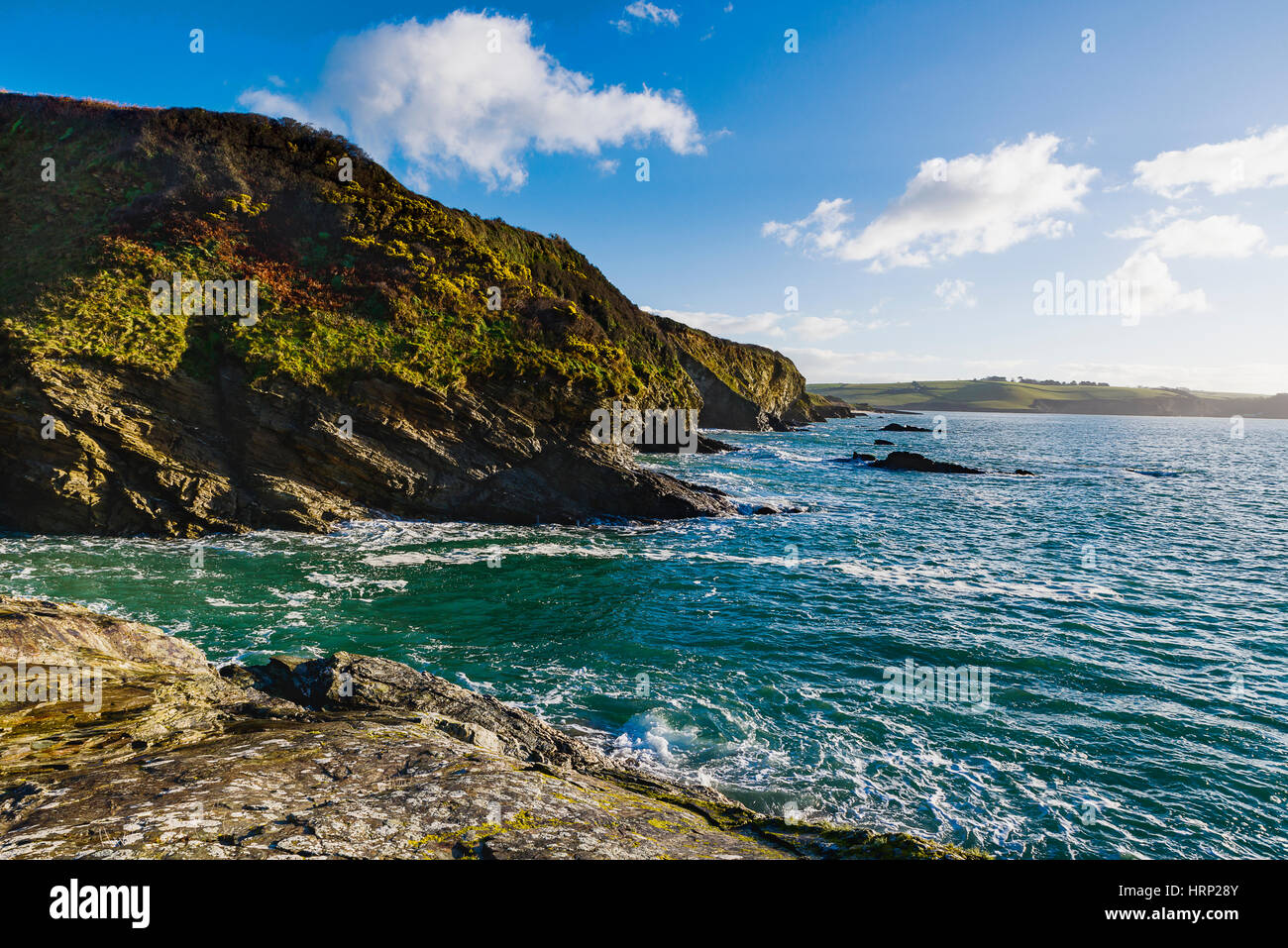 Rocky cliff section between Spit Beach and Carlyon Bay, Cornwall on a ...