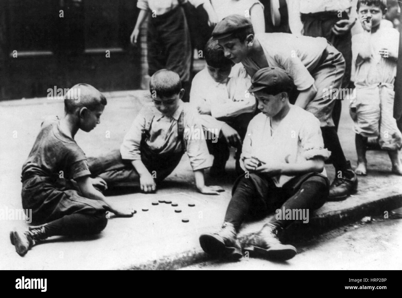 Men playing checkers board game Black and White Stock Photos & Images ...