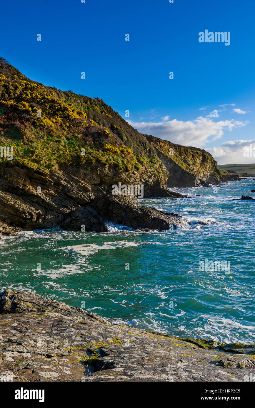 Rocky cliff section between Spit Beach and Carlyon Bay, Cornwall on a ...