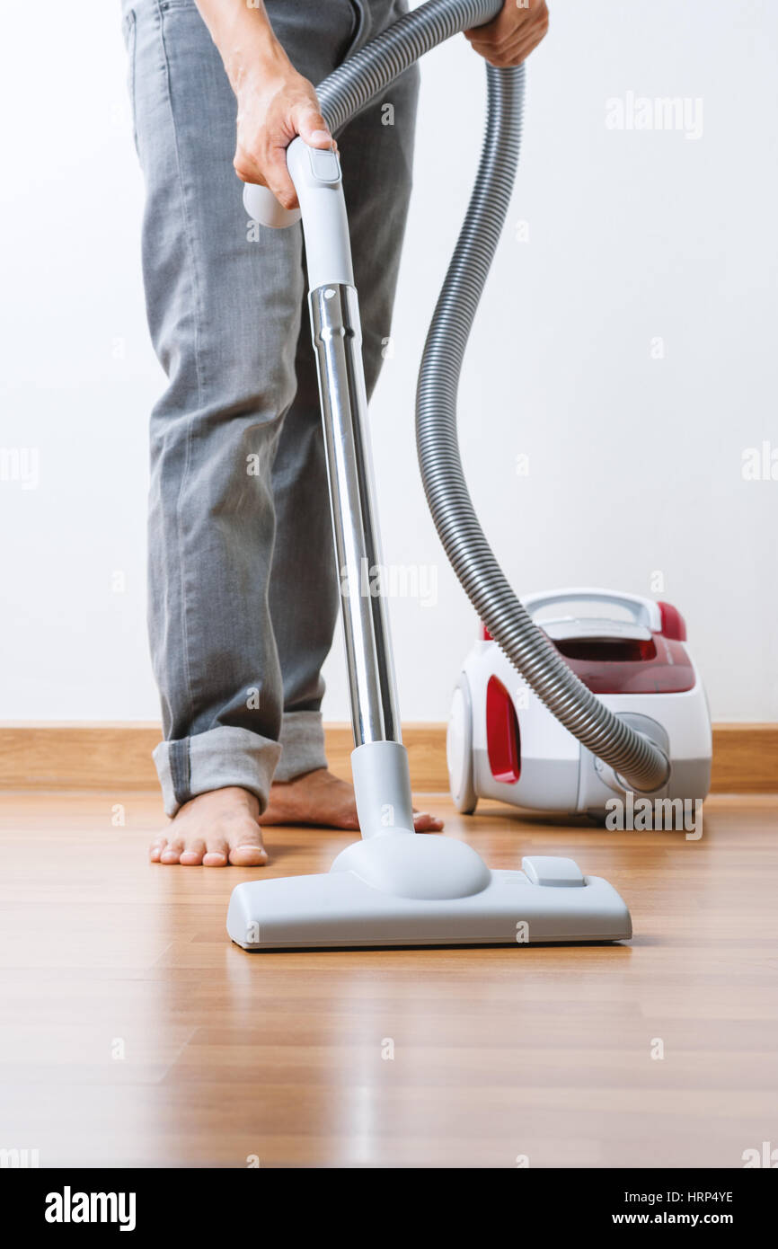 cleaning home with vacuum cleaner, housework concept Stock Photo - Alamy