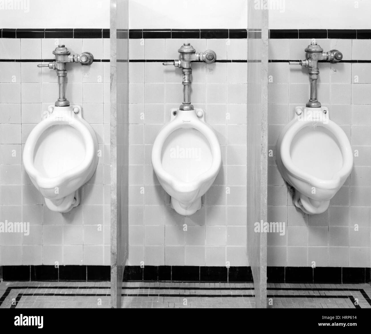 Urinals men's room Black and White Stock Photos & Images - Alamy