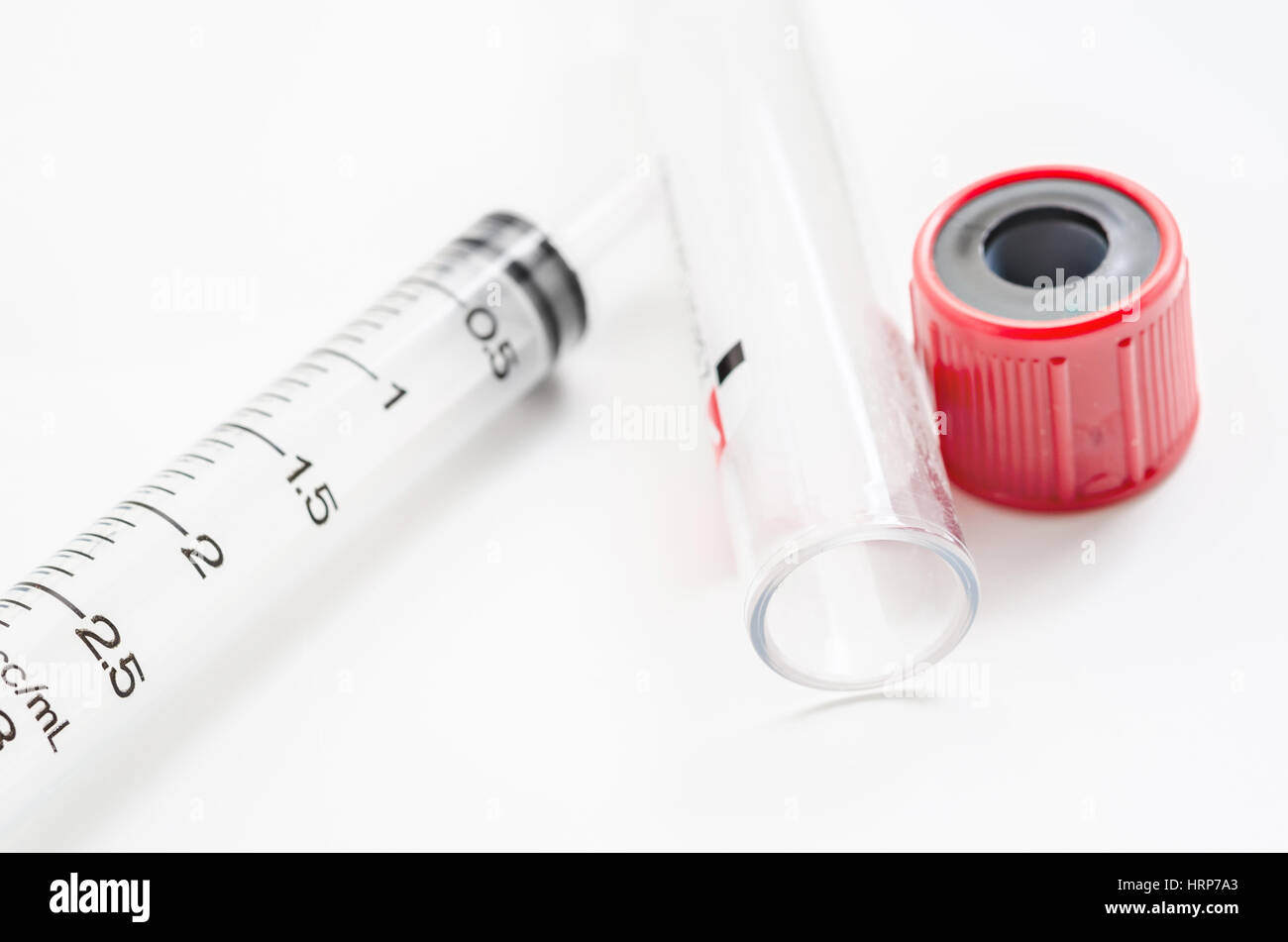 Syringe and Blank blood tube on white background Stock Photo - Alamy